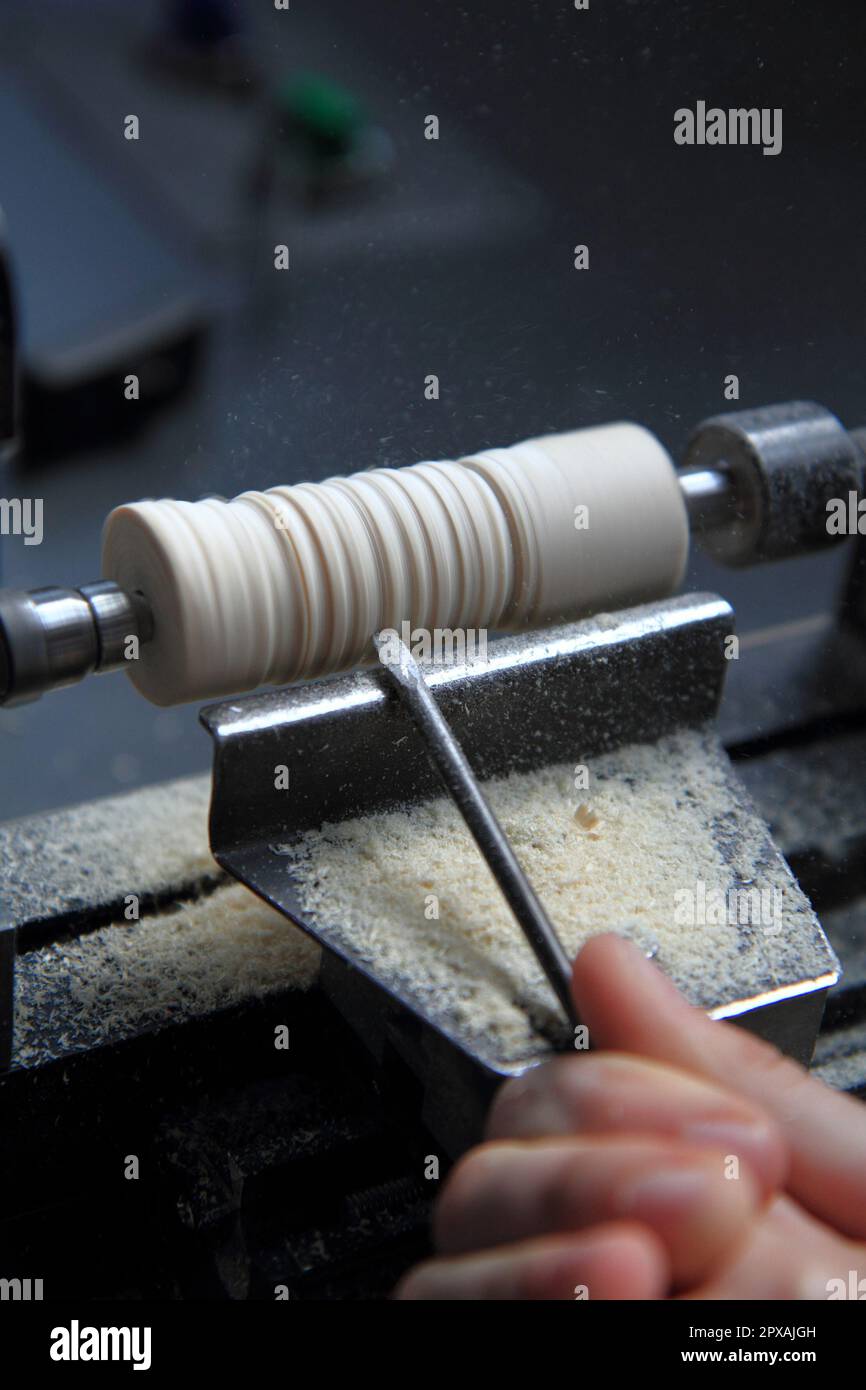 small wood-turning lathe for small wooden toys Stock Photo - Alamy