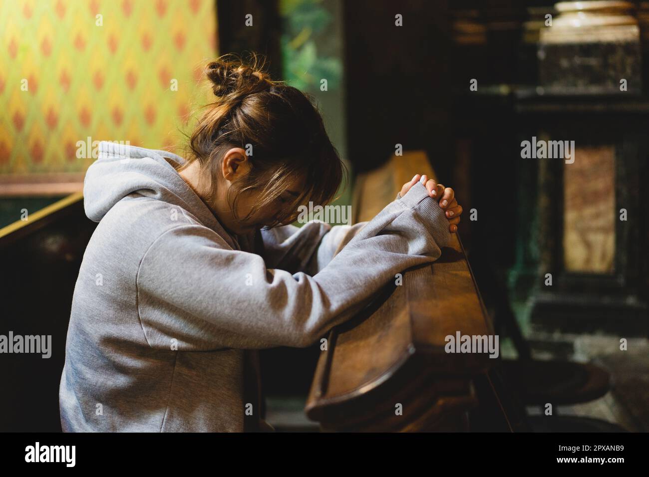 Woman praying on knees catholic hi-res stock photography and images - Alamy