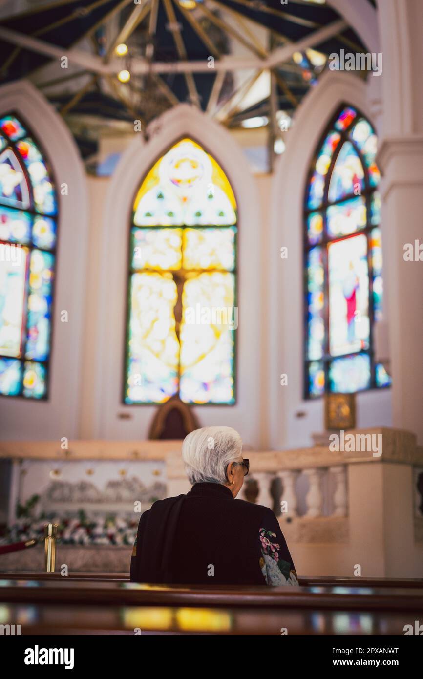 Senior woman praying i the church faith in religious Stock Photo - Alamy