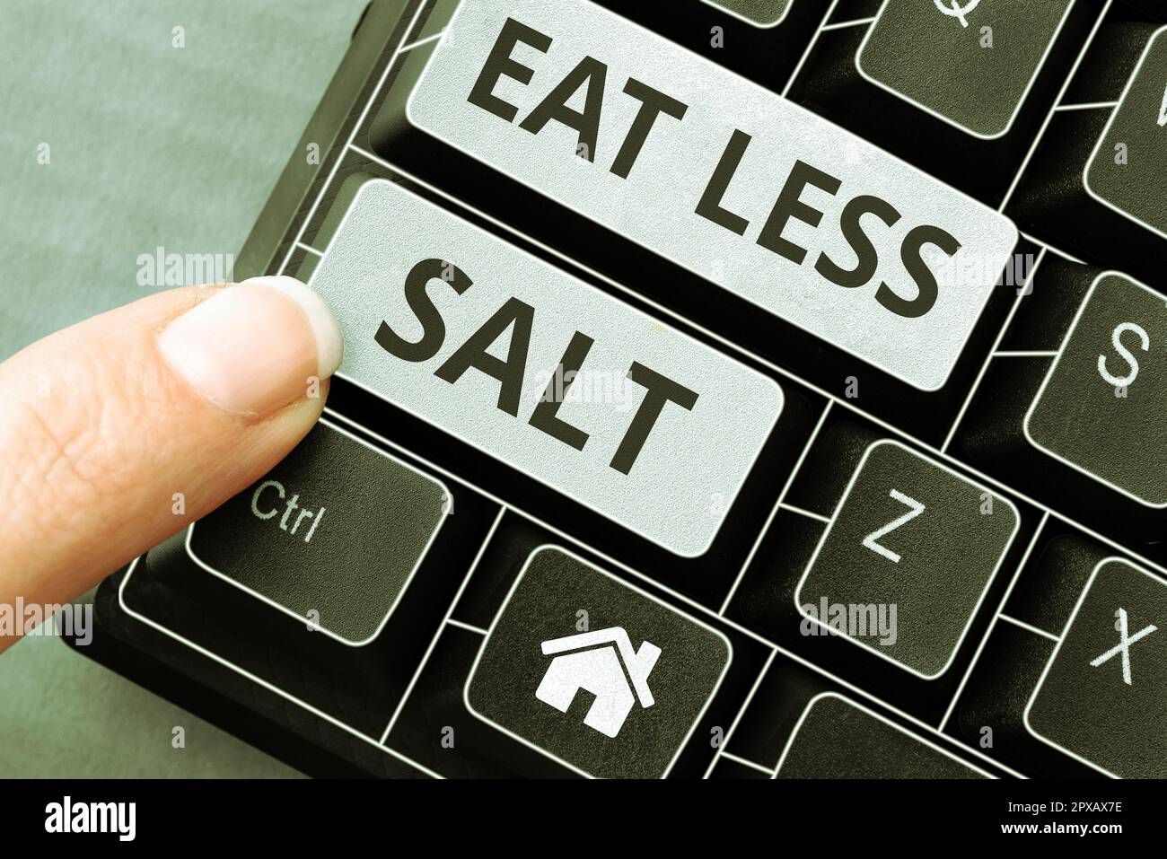 Sign displaying Eat Less Salt, Word Written on reducing the sodium ...