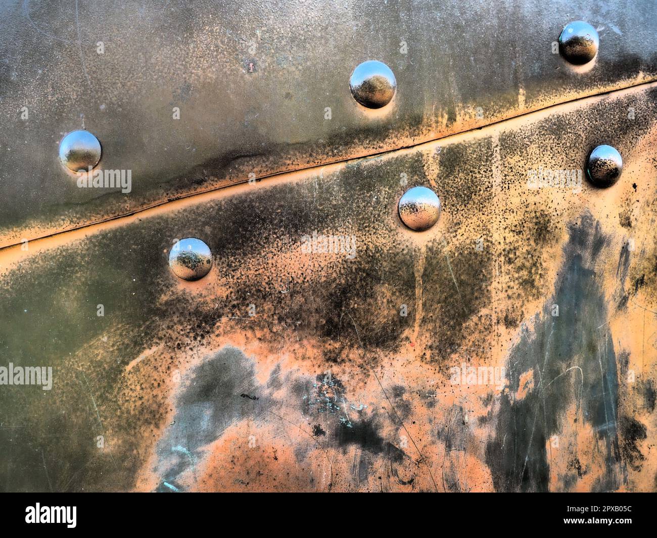 Metal surface with rivets and bolts. Abstract background of a military ...