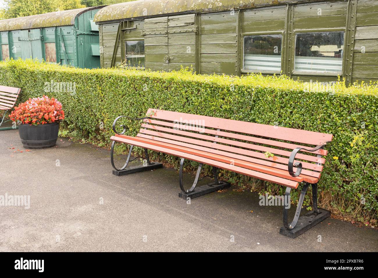 Train platform with red bench Stock Photo - Alamy