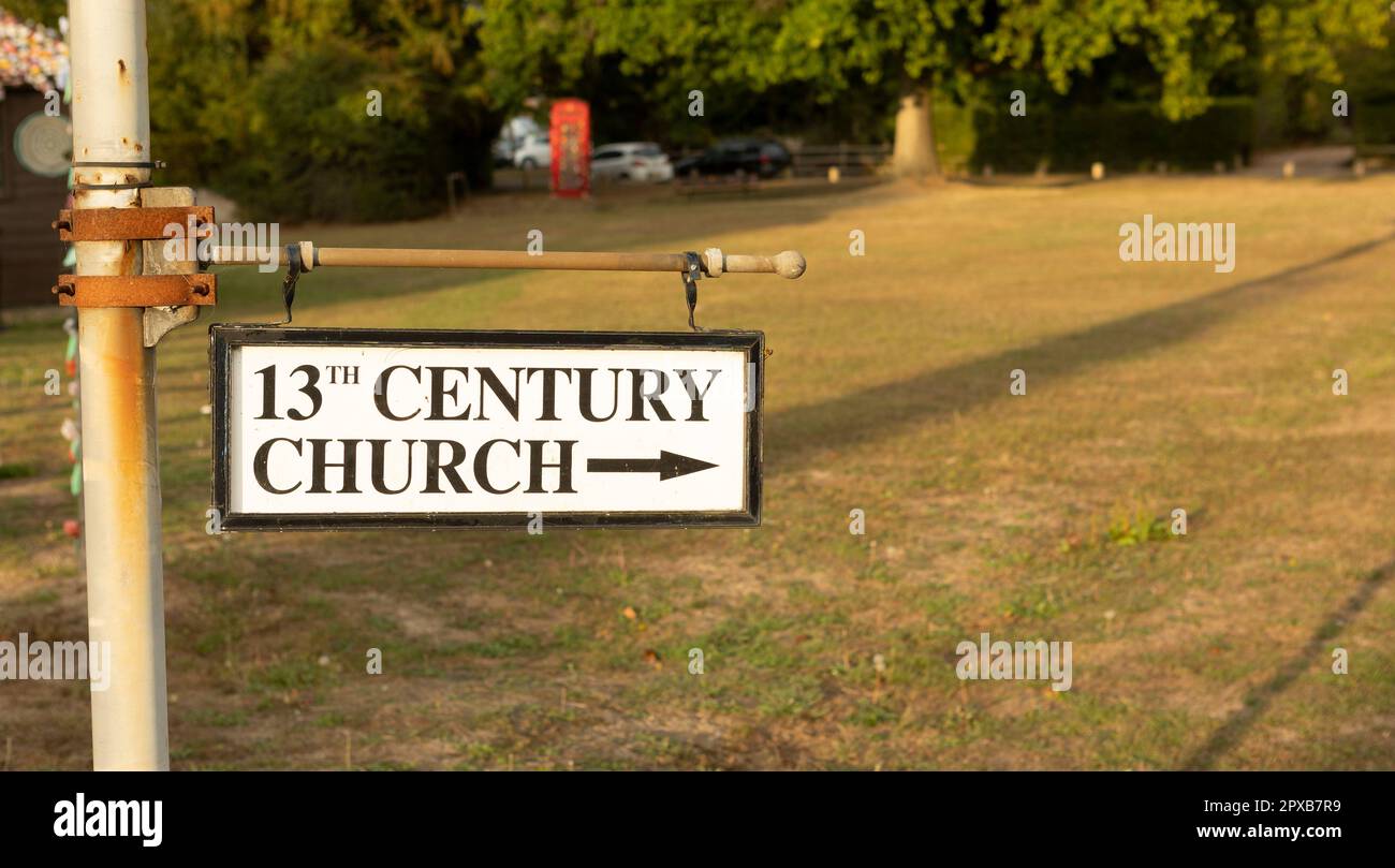 13th century church sign afternoon light Stock Photo - Alamy