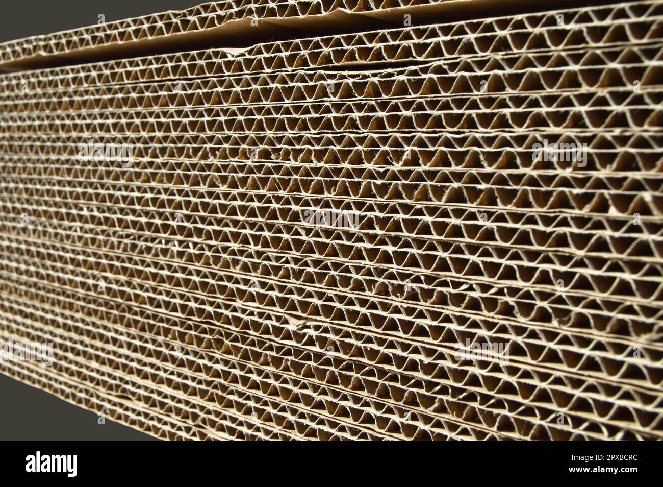 Brown and beige colored corrugated cardboard detail, very suitable for ...