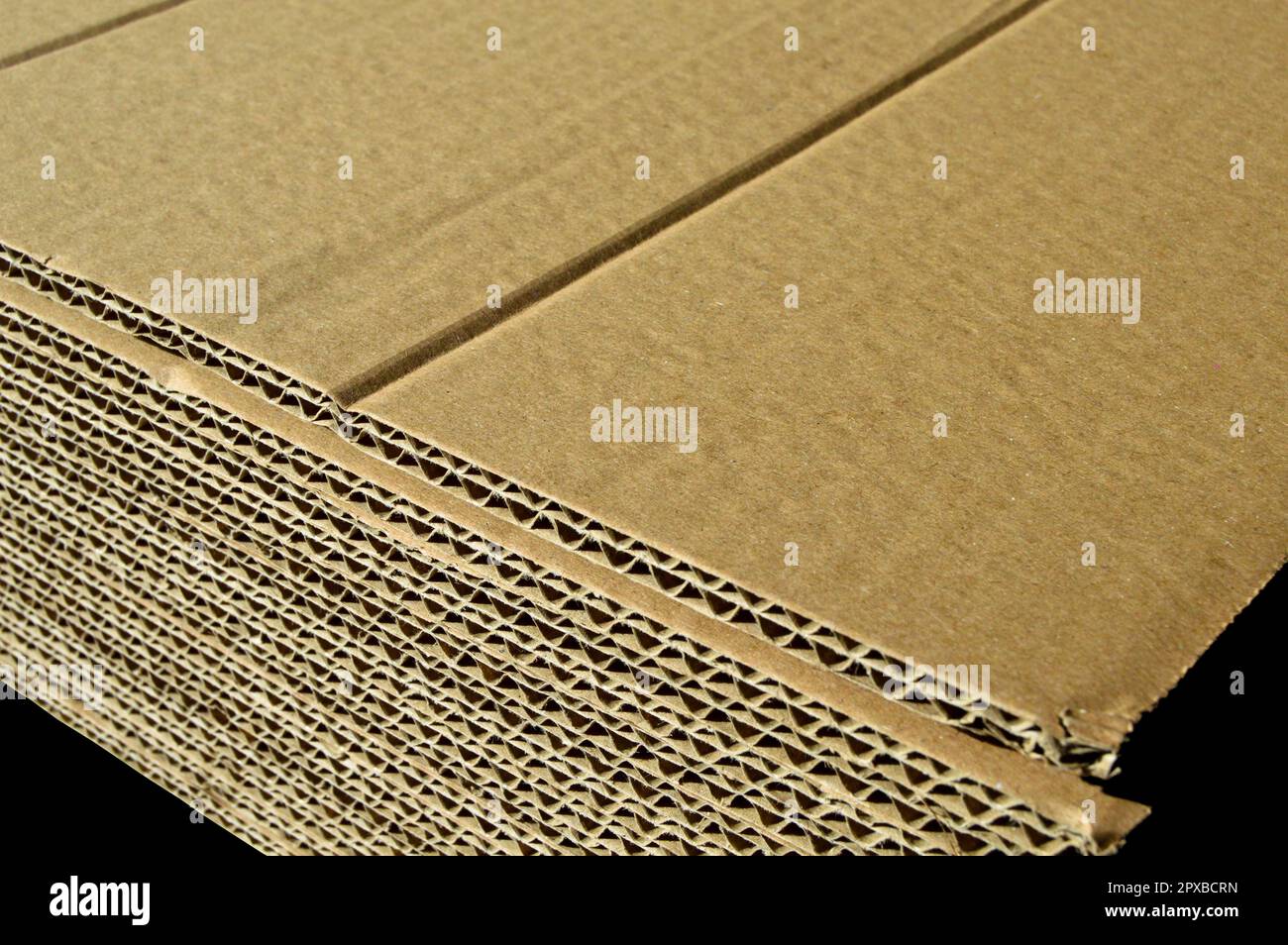 Brown and beige colored corrugated cardboard detail, very suitable for ...