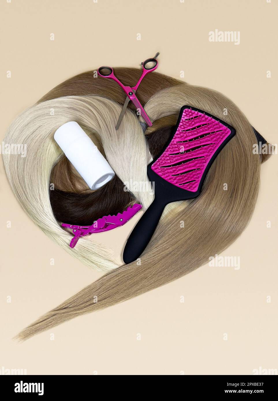 Strands of natural hair in different colors for extensions with tools ...