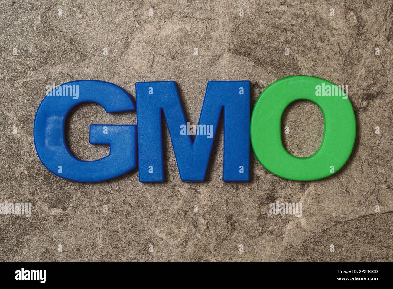 Color alphabet letters in word GMO (abbreviation of Genetically ...