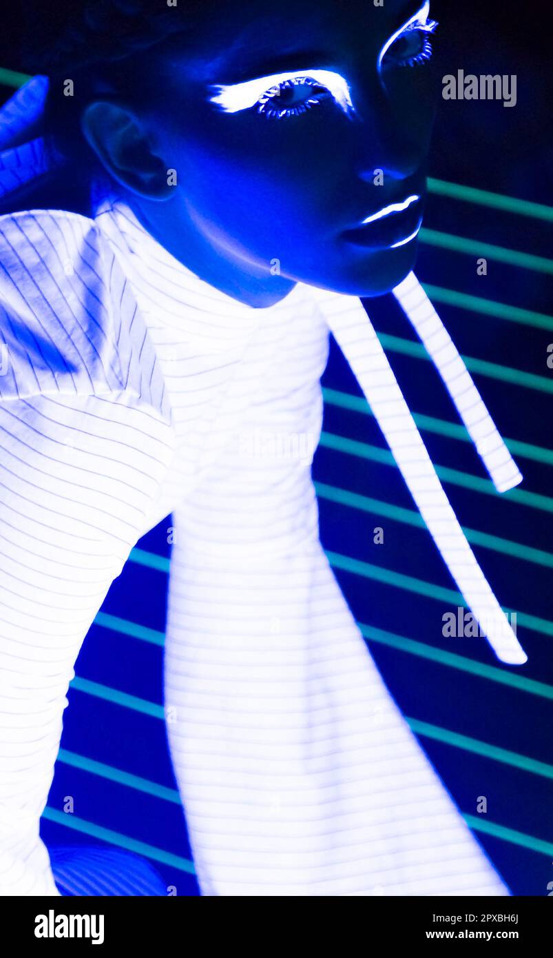 Fashion model beautiful girl in fashionable clothes in ultraviolet ...