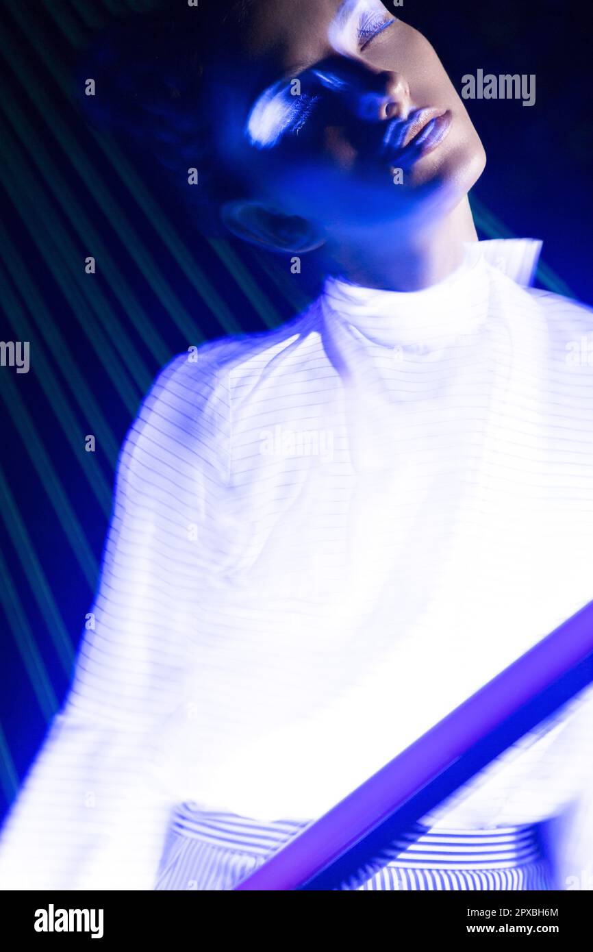 Fashion model beautiful girl in fashionable clothes in ultraviolet ...