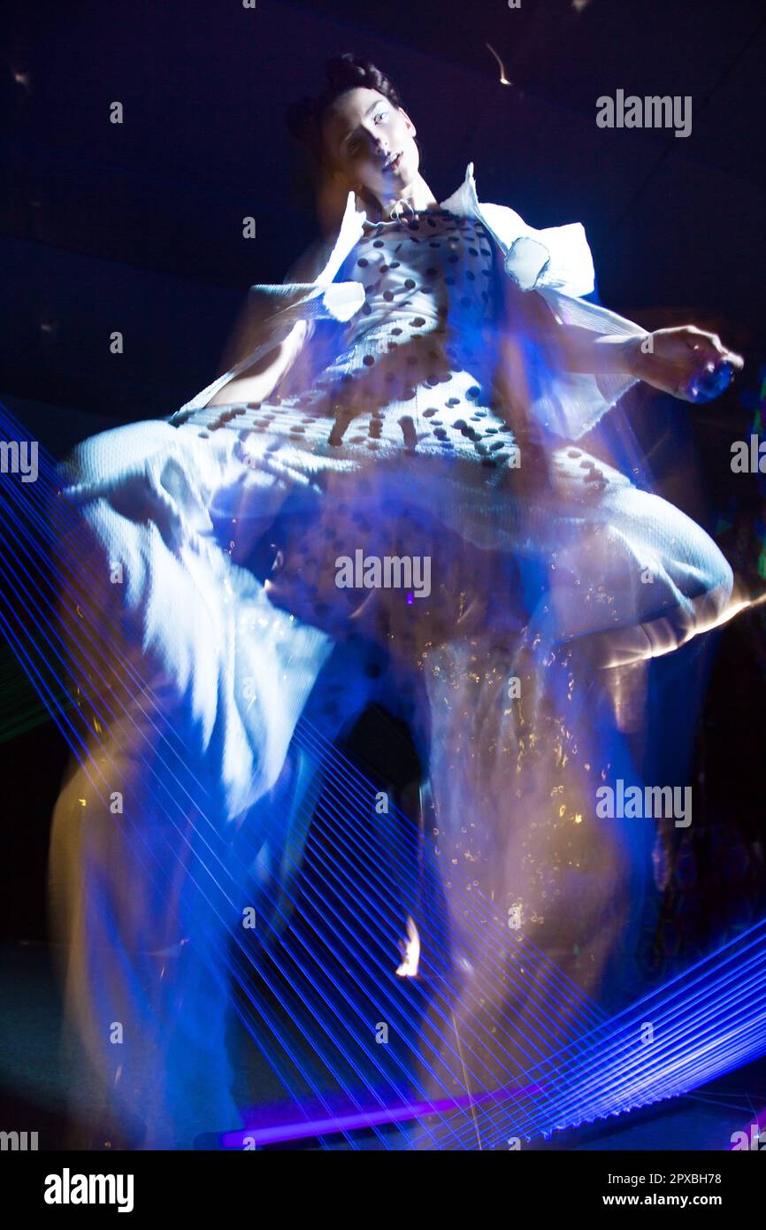 Fashion model beautiful girl in fashionable clothes in ultraviolet ...