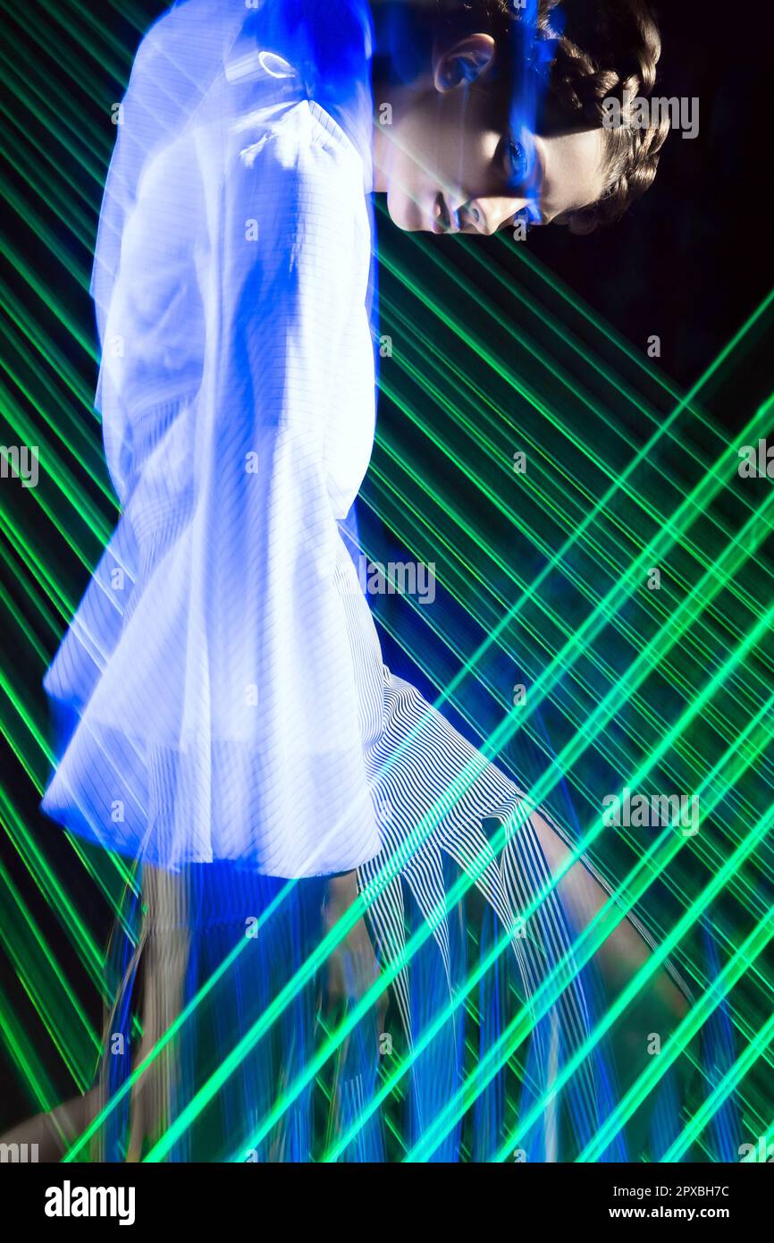 Fashion model beautiful girl in fashionable clothes in ultraviolet ...