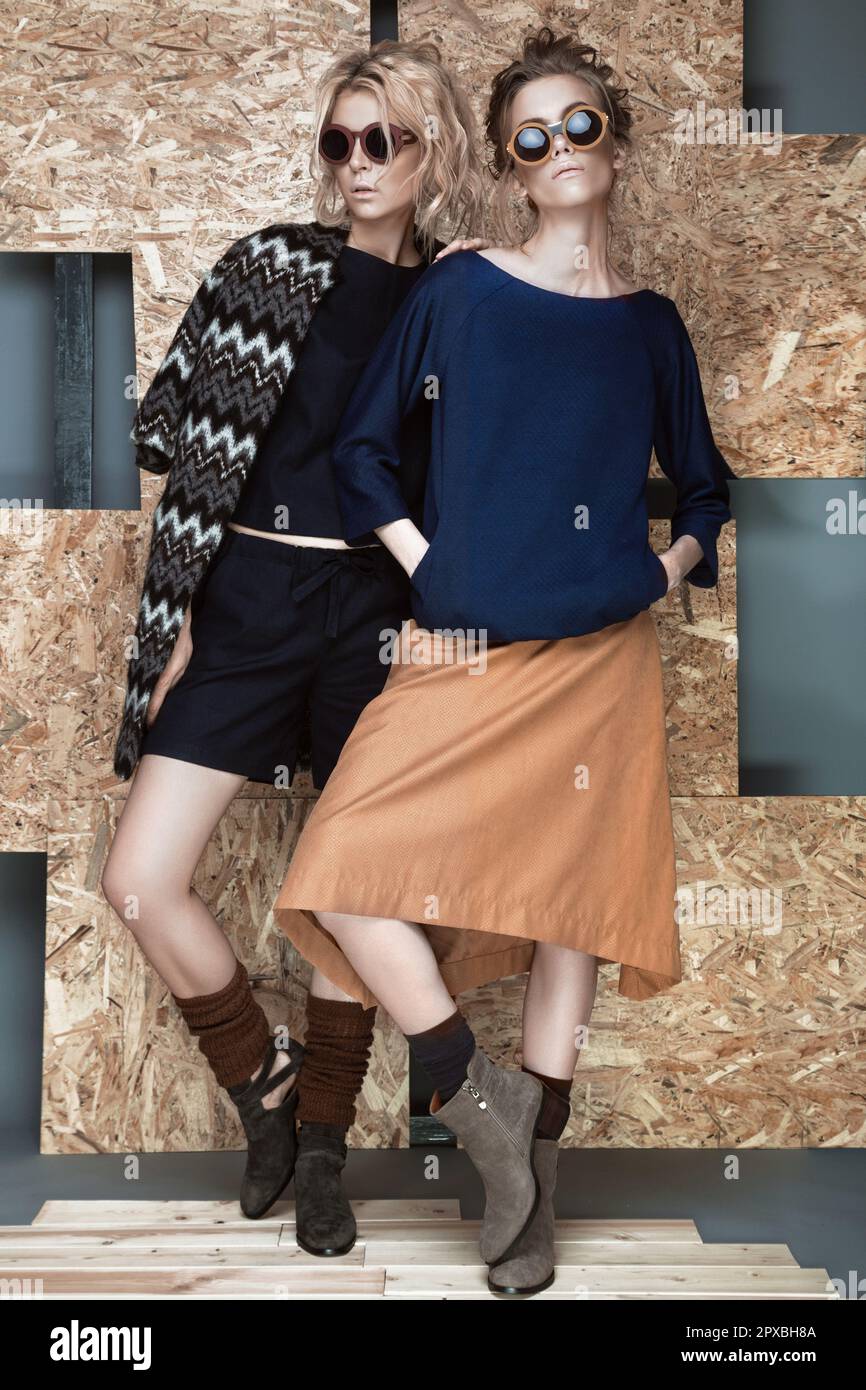 Beautiful fashionable girls in a stylish dress, showing different poses ...