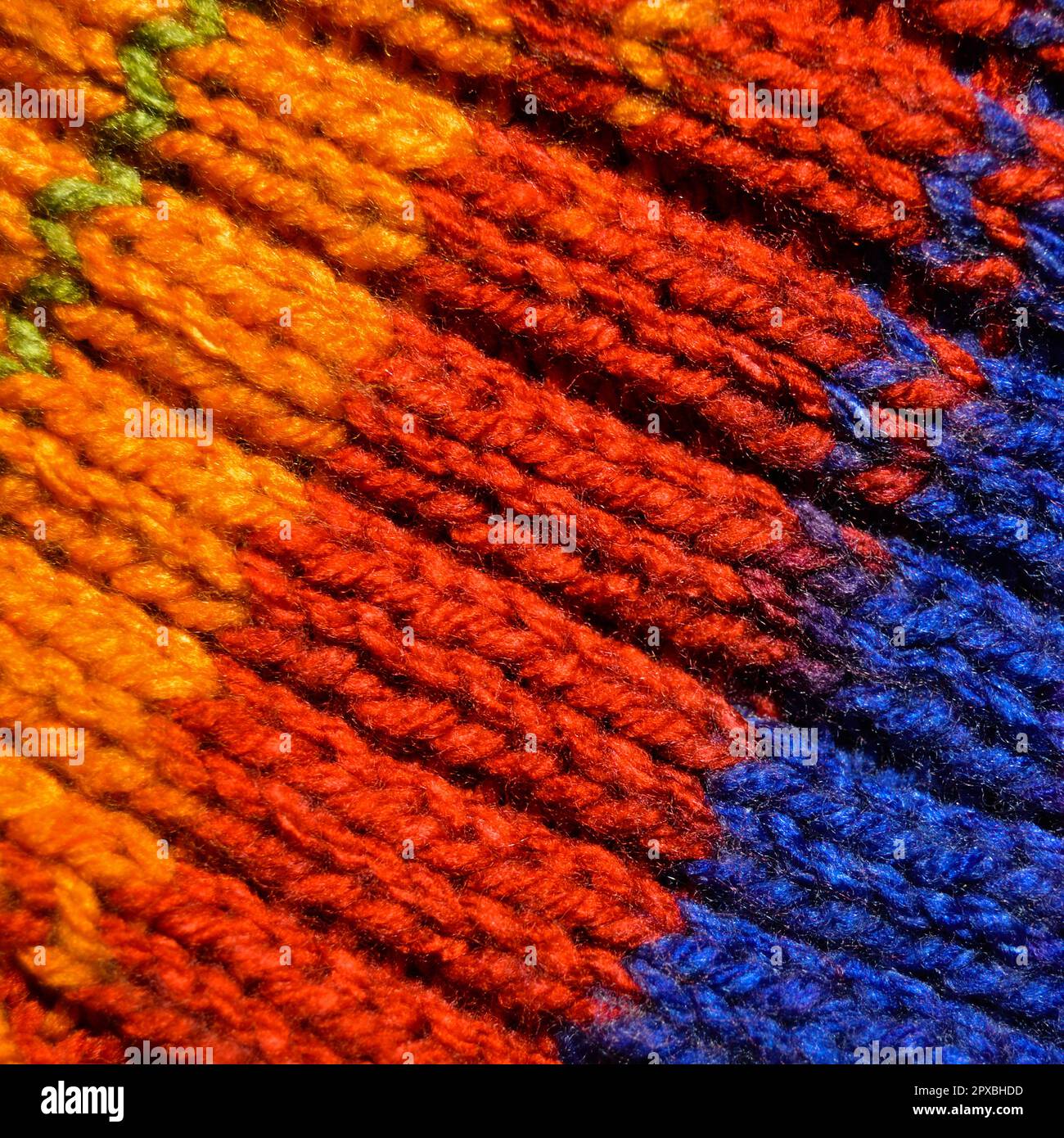Pattern fabric made of wool. Handmade knitted fabric colored wool ...