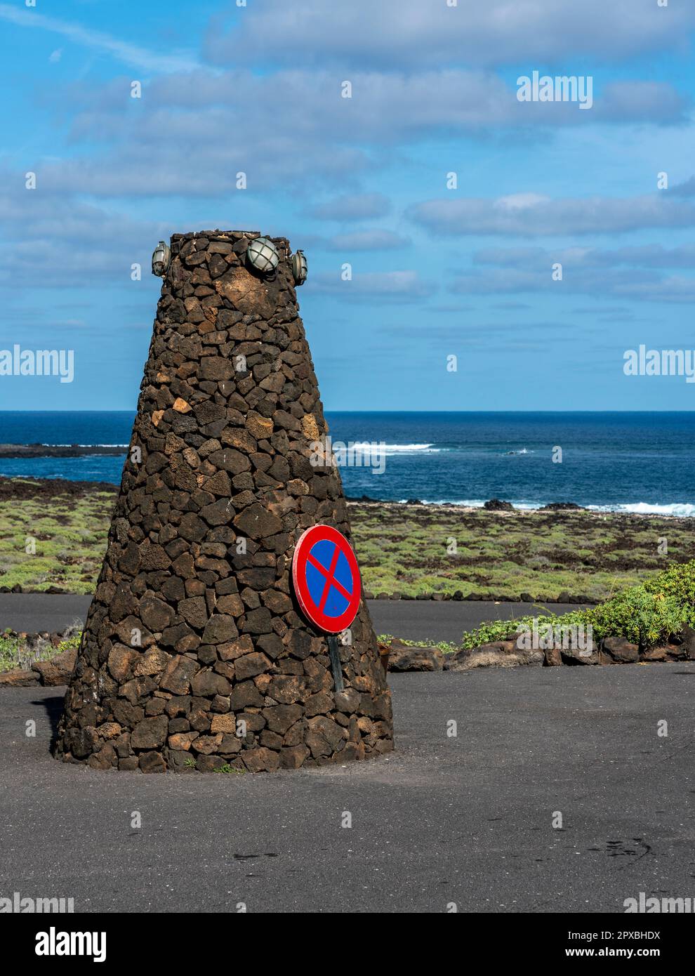 Traffic Signs On A Stone Pillar, Lanzarote, Canary Islands, Spain Stock ...