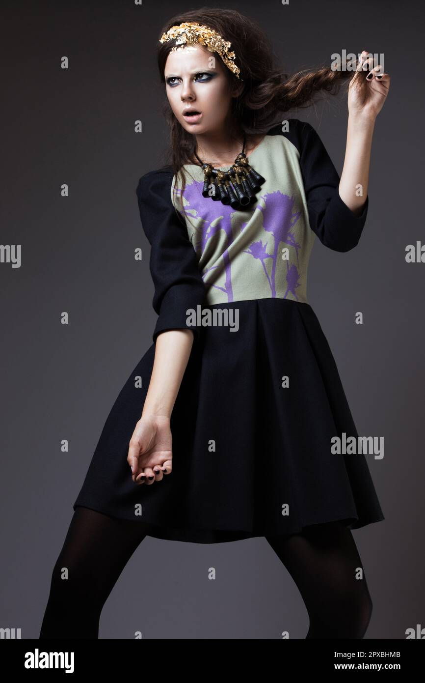 Beautiful fashionable girls in a stylish dress, showing different poses ...