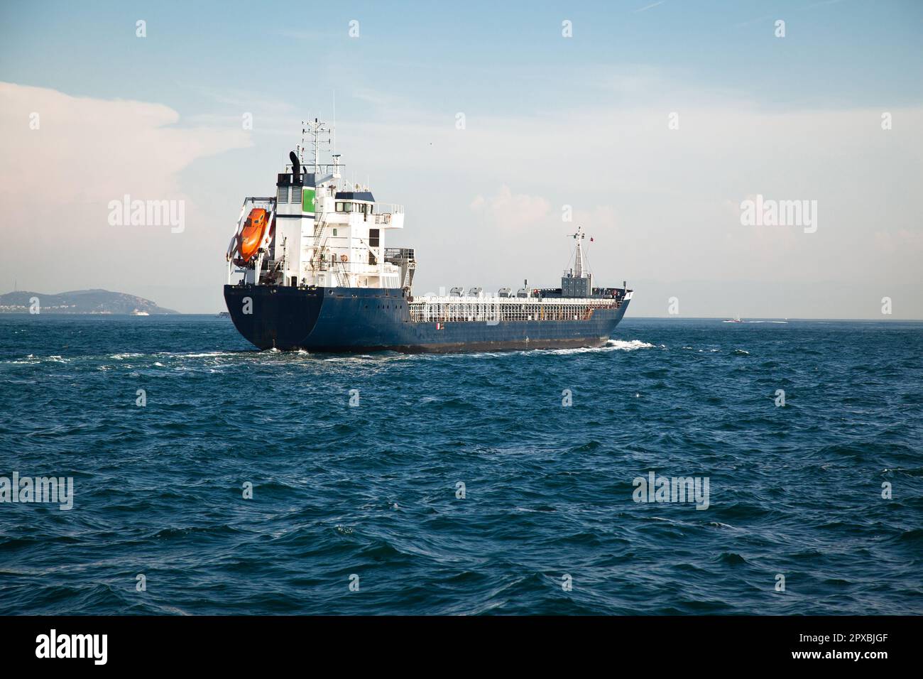 Large cargo ship, cargo ship carrying containers, engaged in ...