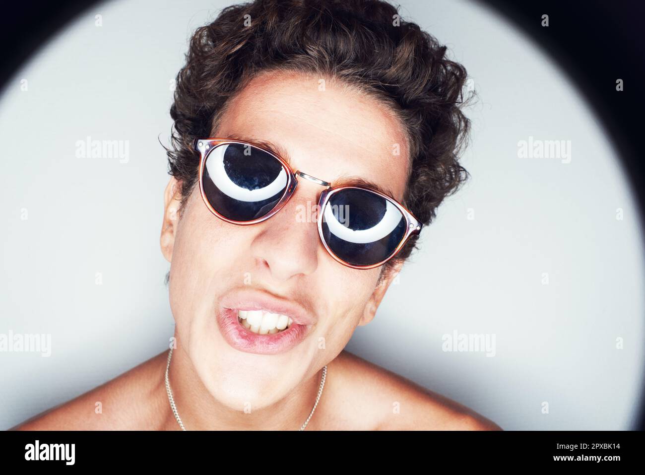 Say what. Close up portrait of a young man with his lips curled ...