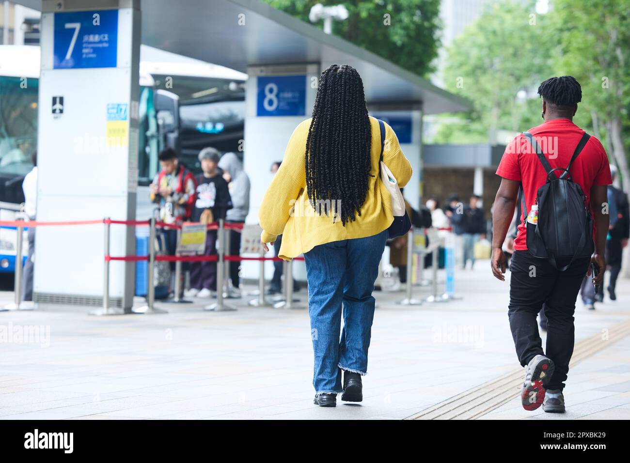 Foreign tourists walk on the departure platforms at Tokyo Yaesu bus ...