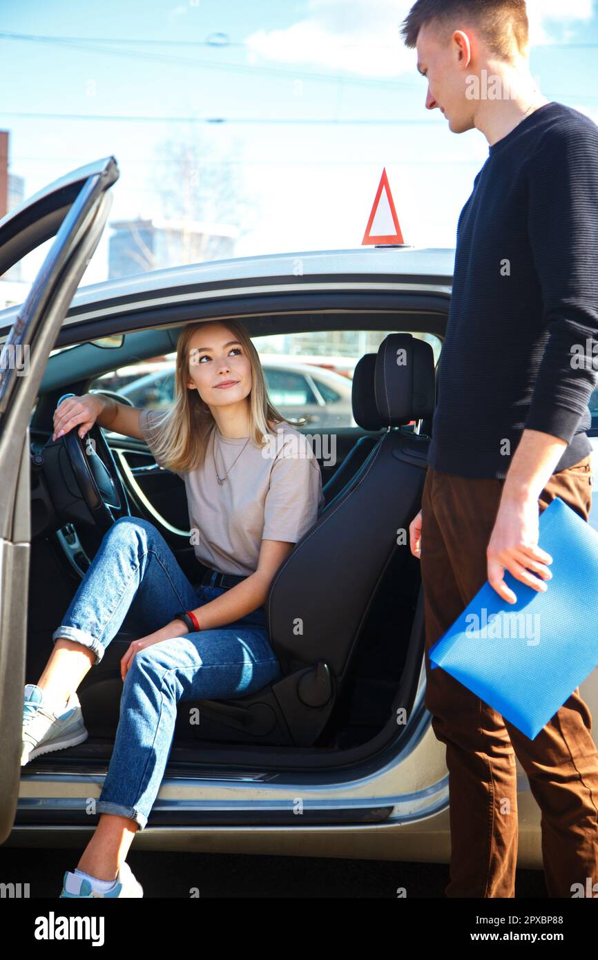The driver is an auto school instructor and a female student on an ...