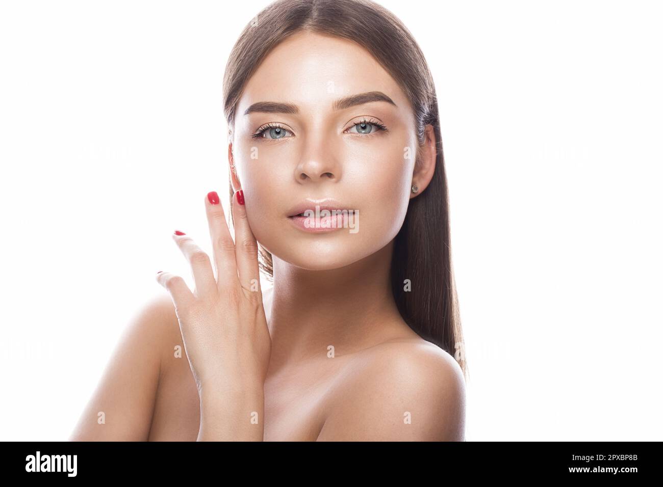 Beautiful young girl with a light natural make-up and perfect skin ...