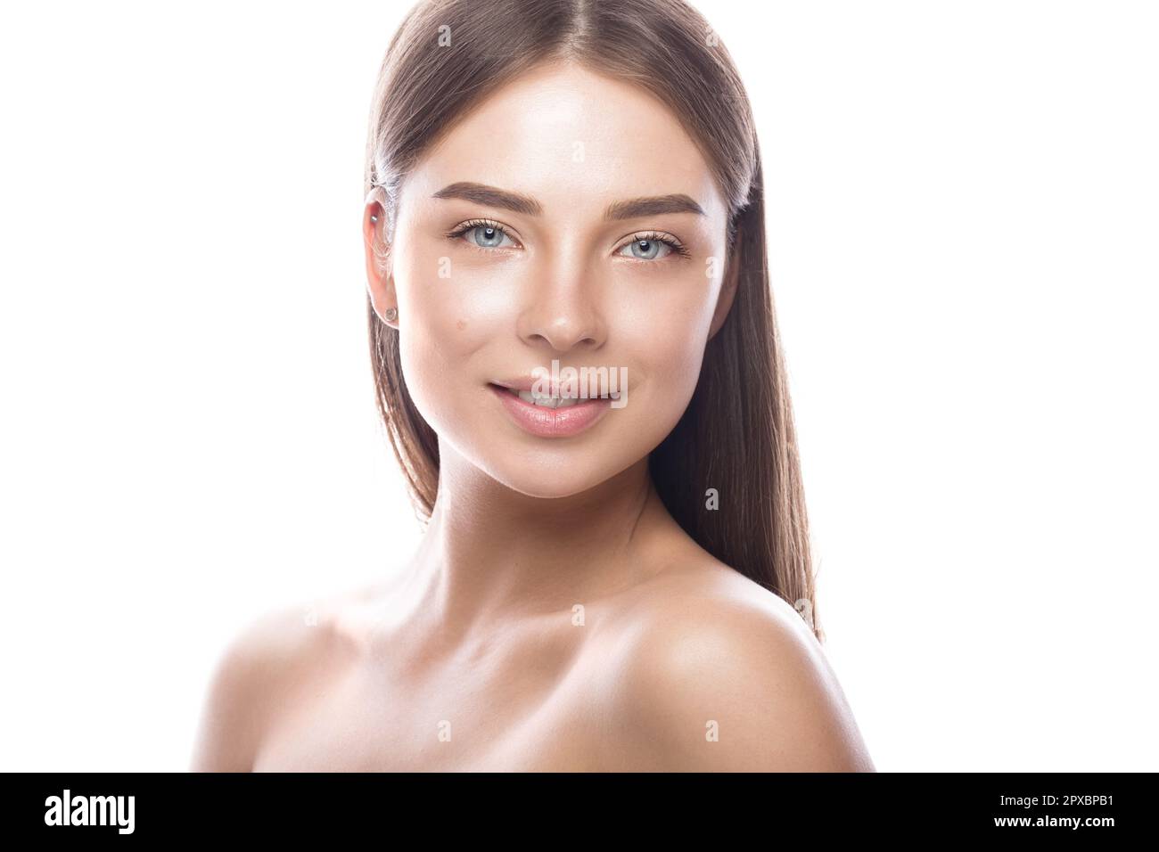 Beautiful young girl with a light natural make-up and perfect skin ...