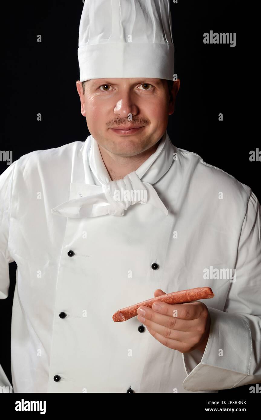 Portrait of a cook in chef clothes against white background Stock Photo ...