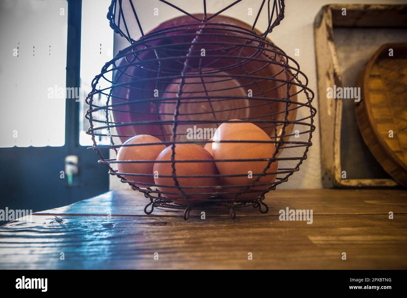 Old rusty wire egg cup. Country style background. Selective focus Stock ...