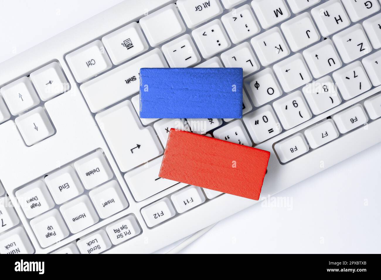 Colored cube with important message lying on keyboard. Main information ...