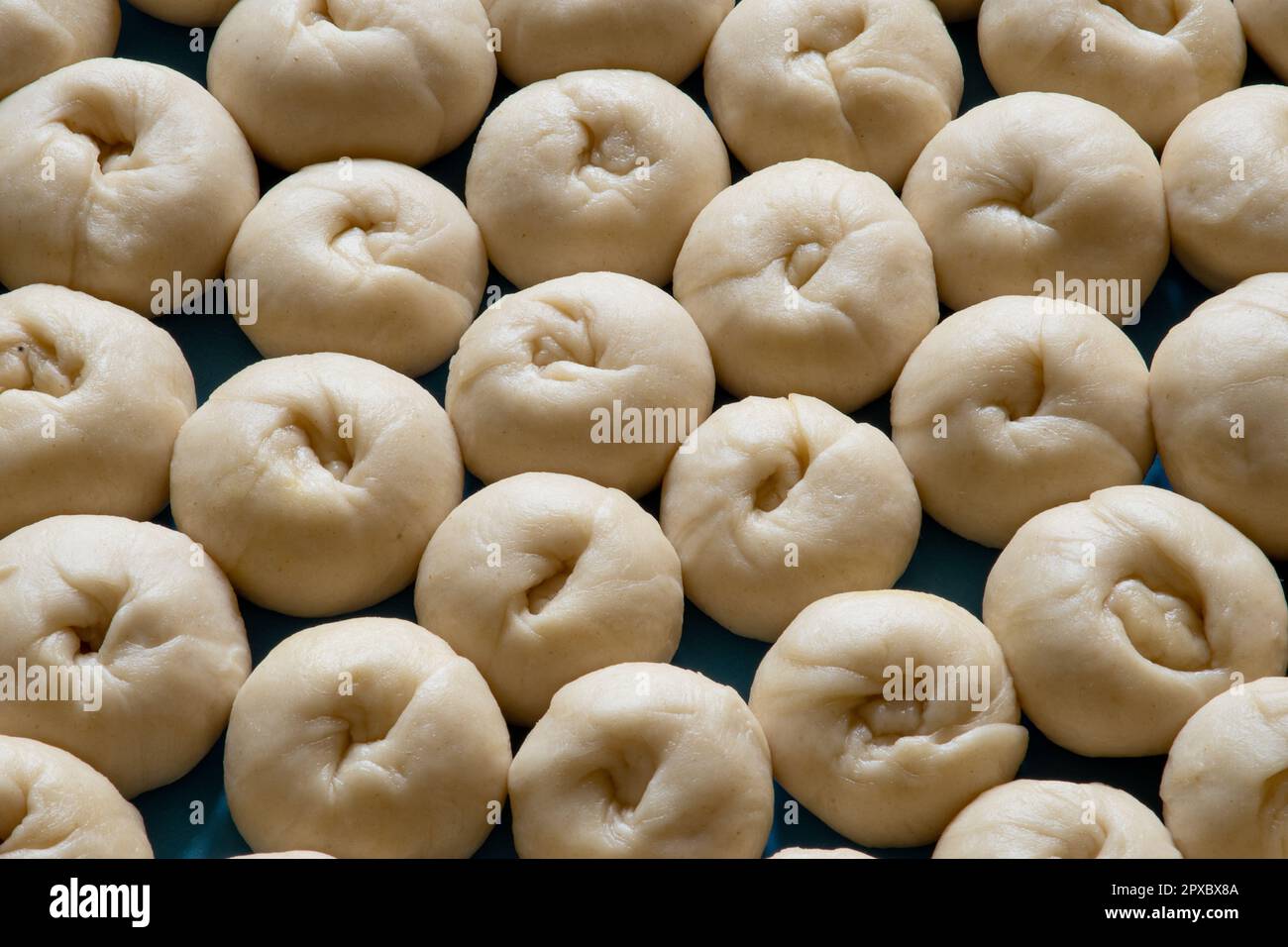 Close-up of some small homemade freshly fermented raw bread dough pulp ...
