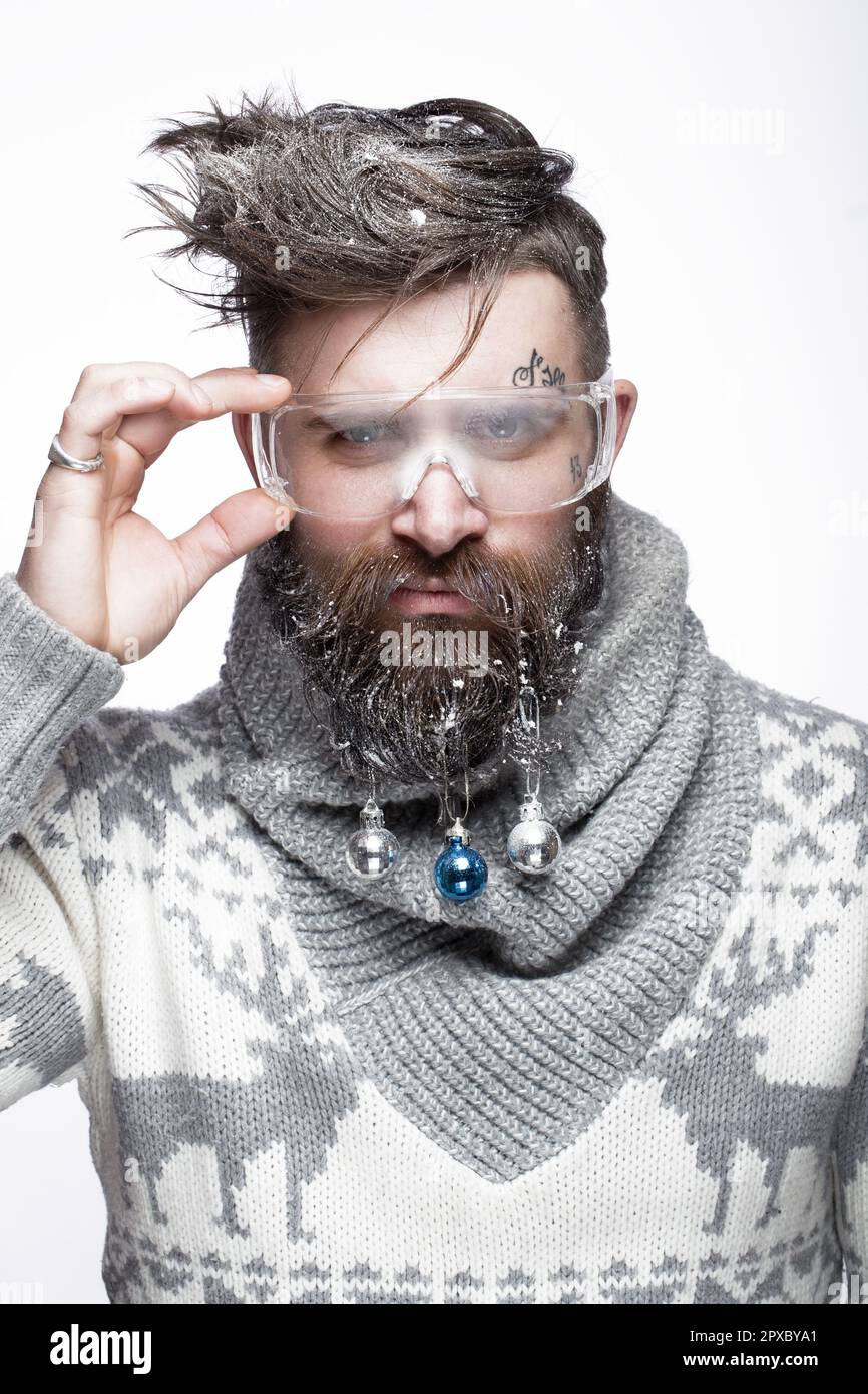 Funny bearded man in a New Year's image with snow and decorations on ...