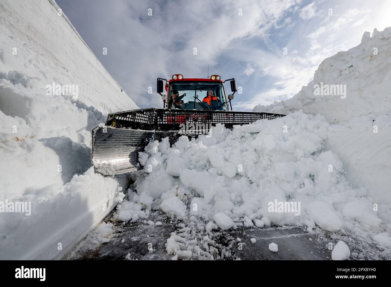 A snowcat of Meadow Hut (Lucni bouda) removes a mass of snow in the ...