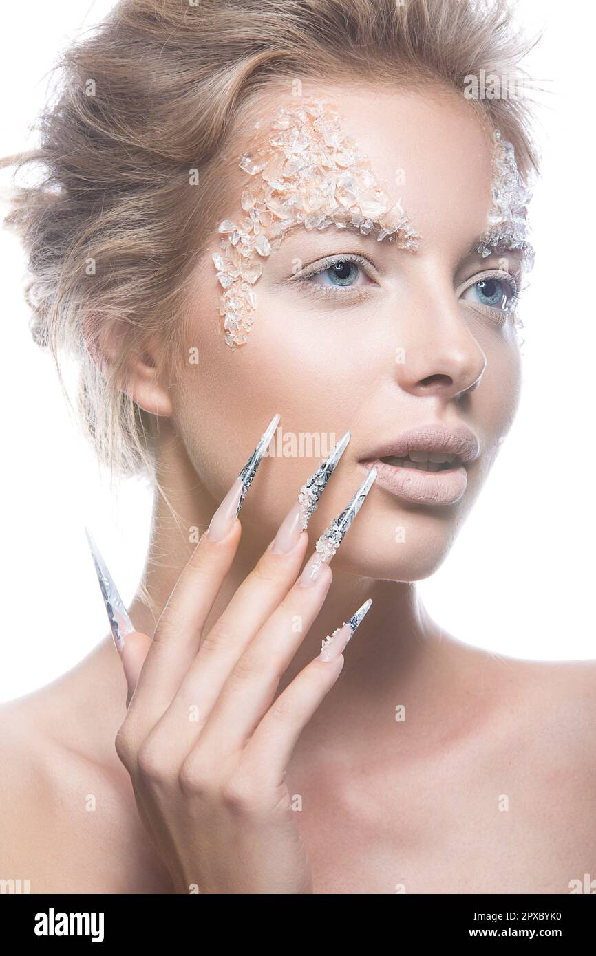 Beautiful fashion model with long nails, creative makeup and manicure ...