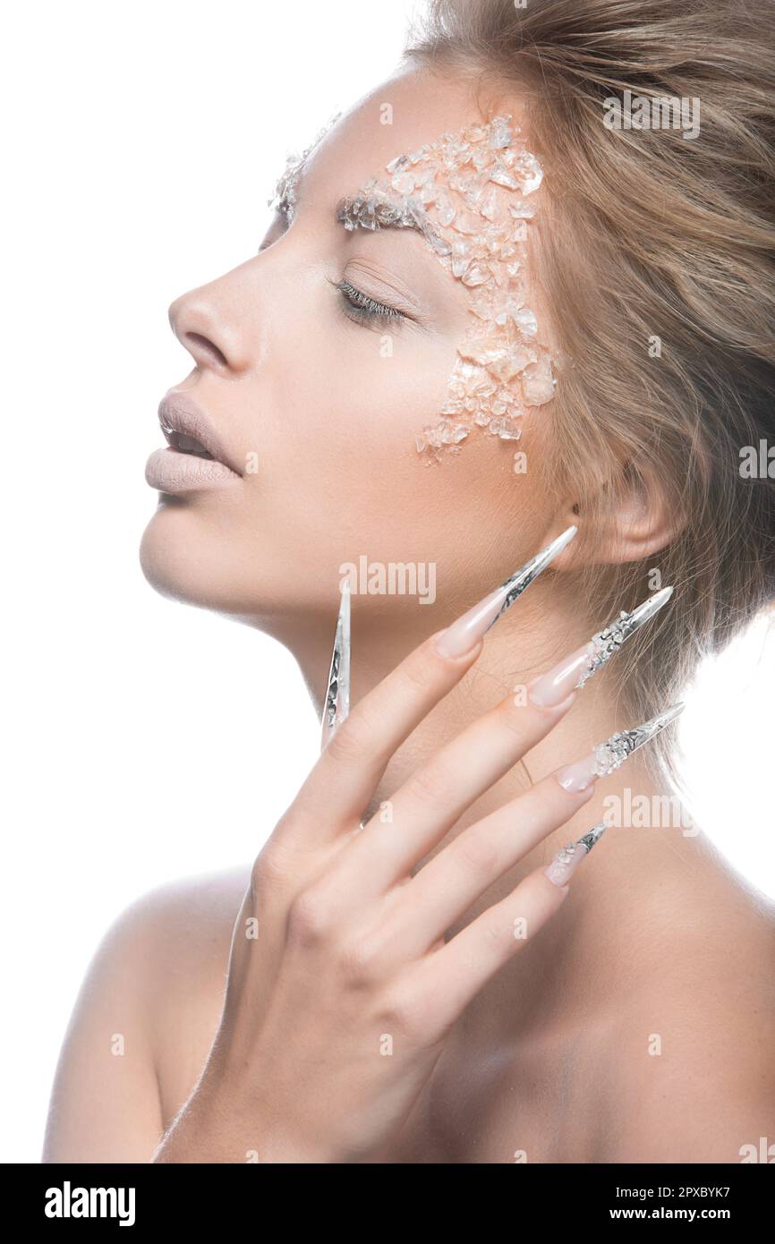 Beautiful fashion model with long nails, creative makeup and manicure ...