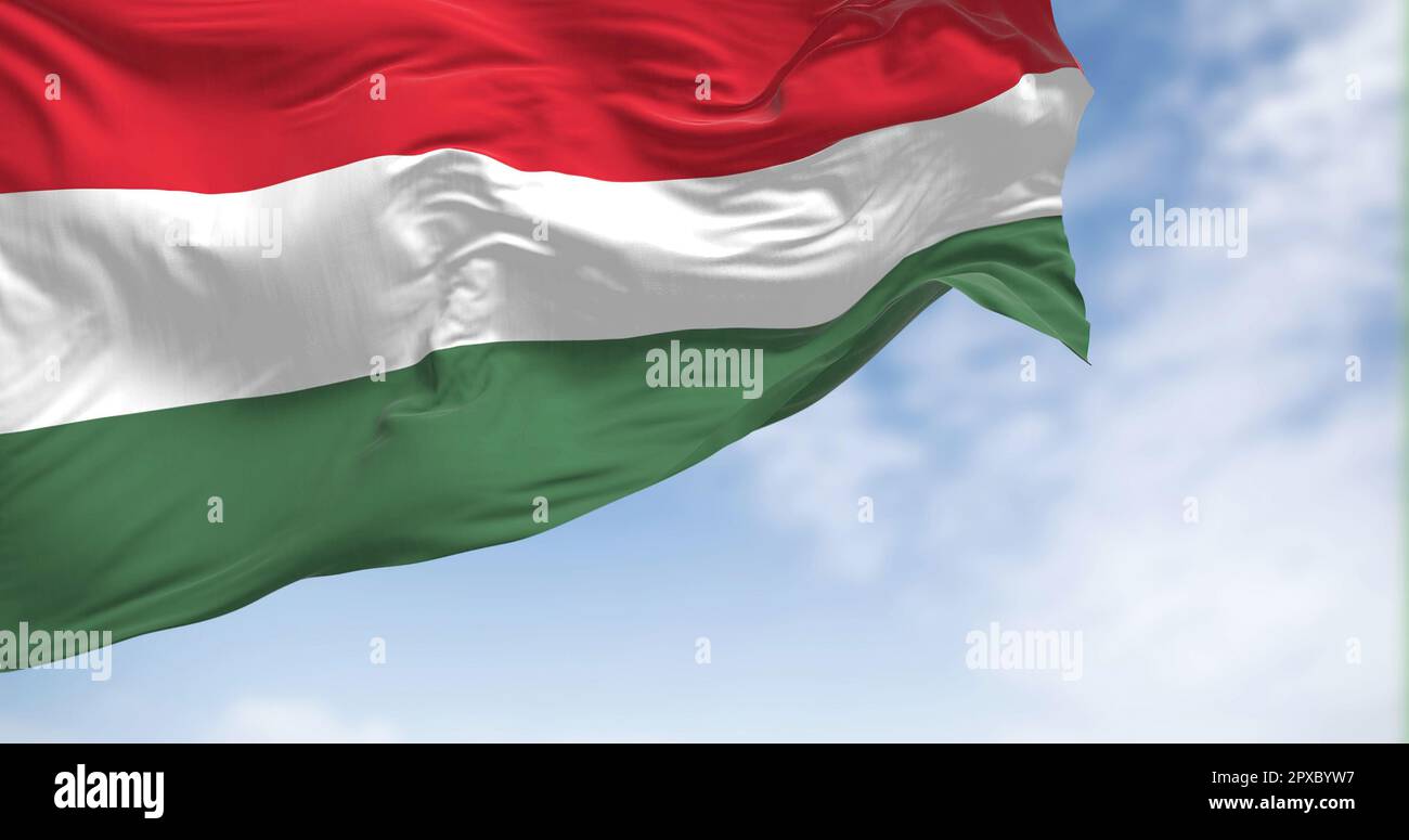 The national flag of Hungary fluttering in the wind on a clear day ...