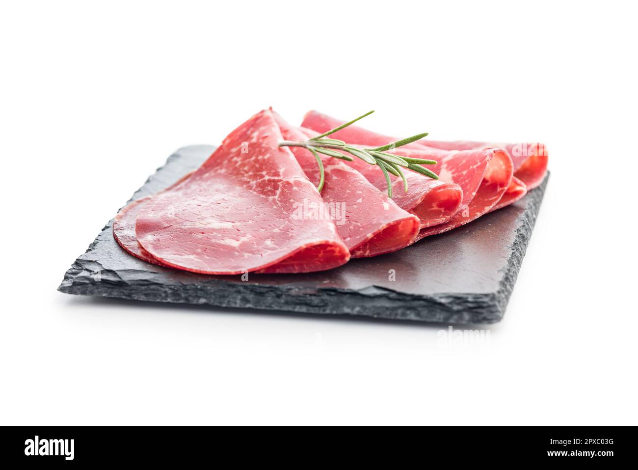 Smoked bresaola. Italian appetizer. Dried beef meat isolated on the ...