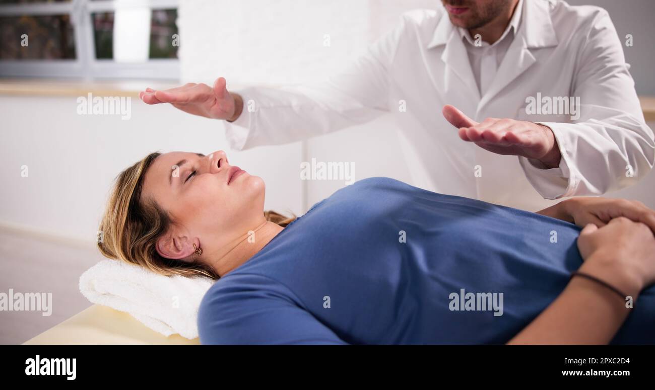 Reiki Therapy Alternative Healing Massage For Man Stock Photo - Alamy