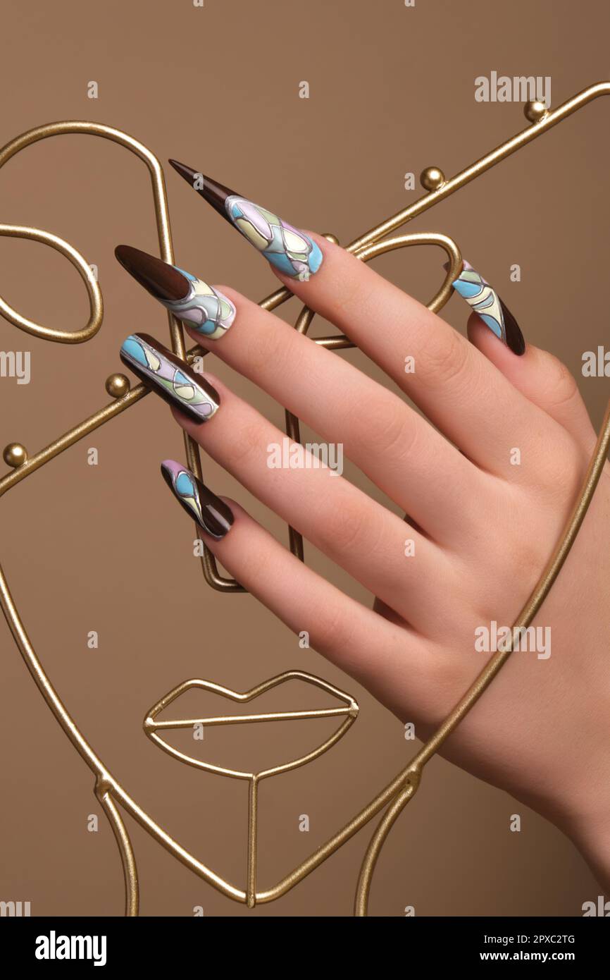 Creative design of nails on female hands. Art manicure. Photo taken in ...