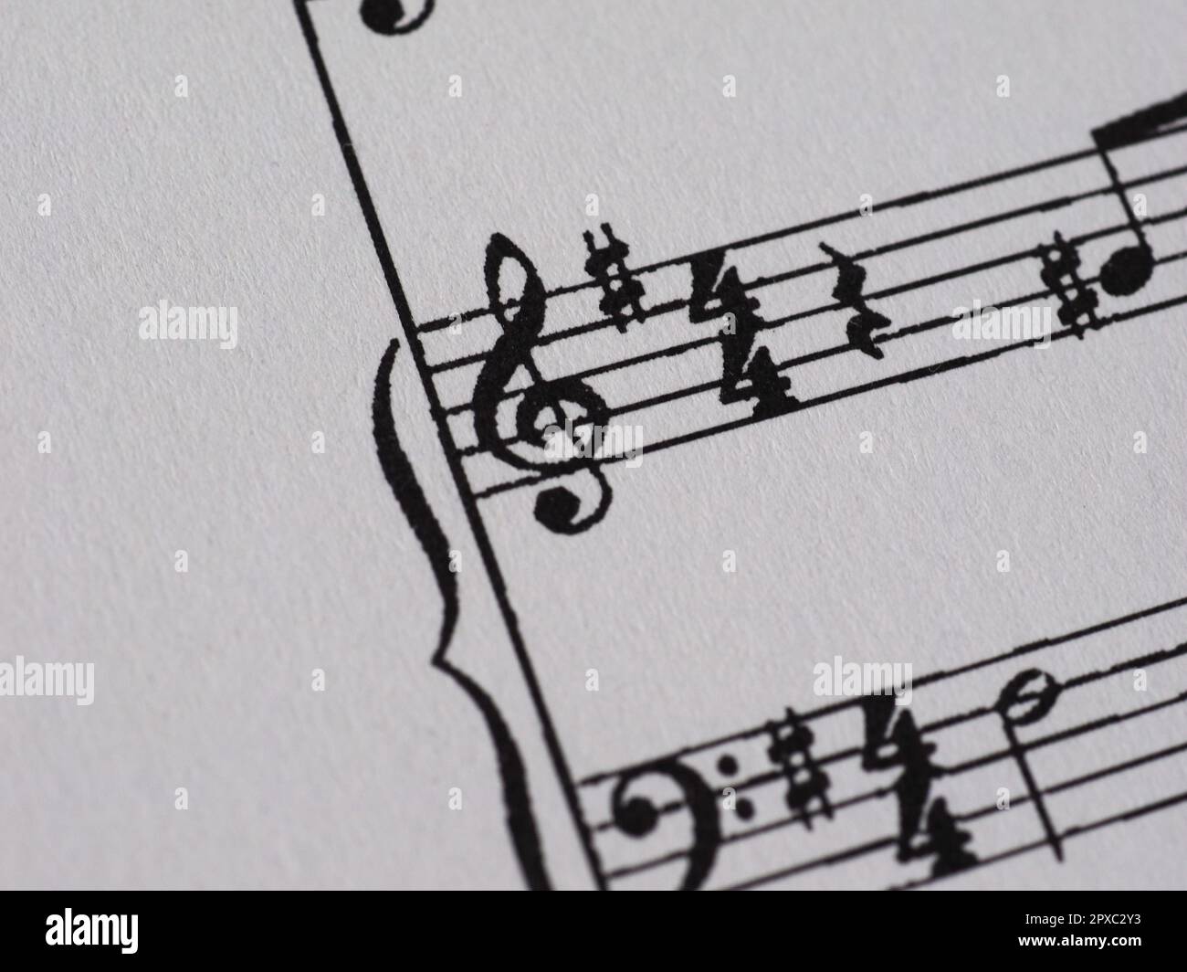 Treble clef and time signature on a music staff Stock Photo - Alamy