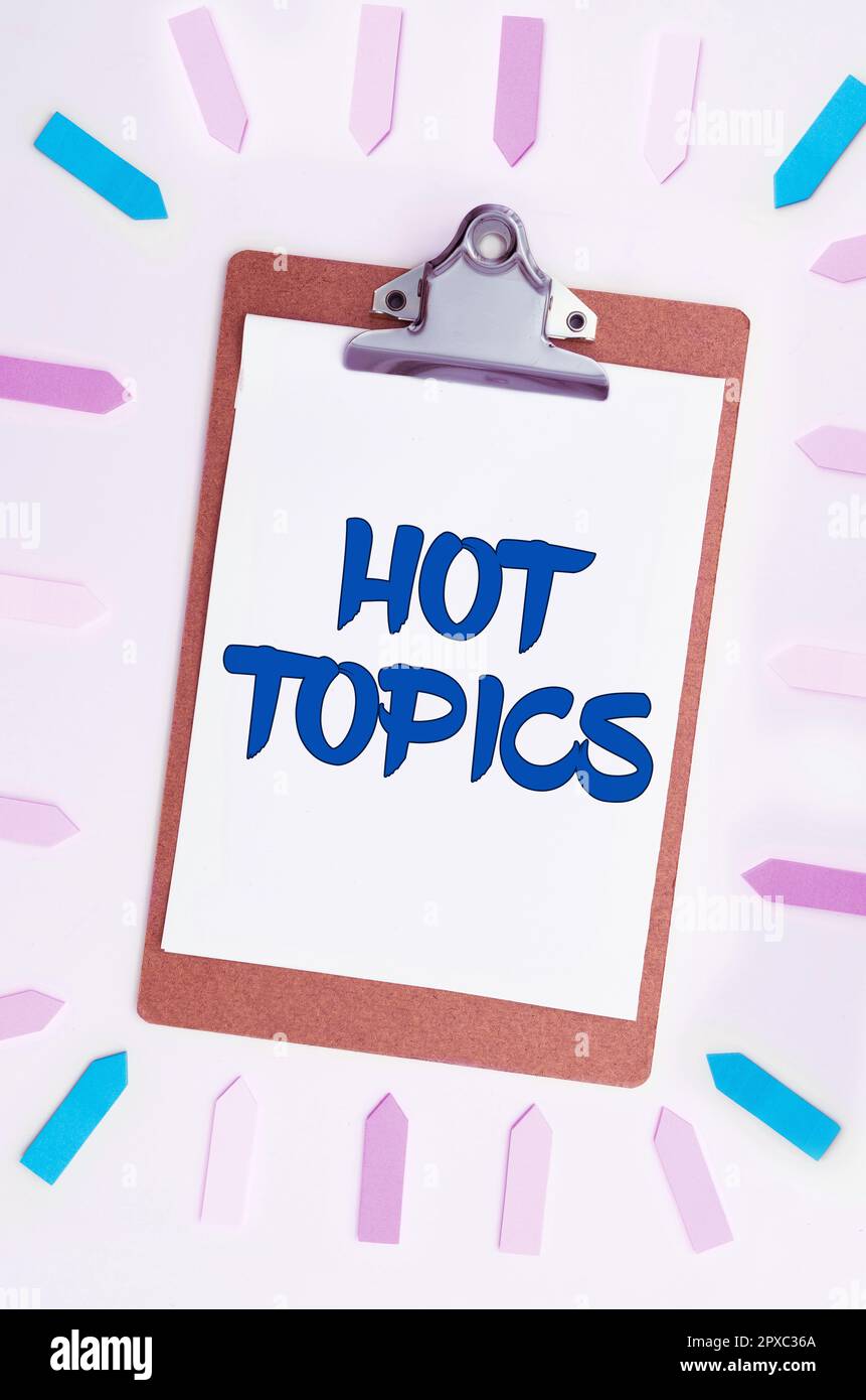 Hand writing sign Hot Topics, Internet Concept subject that a lot of ...