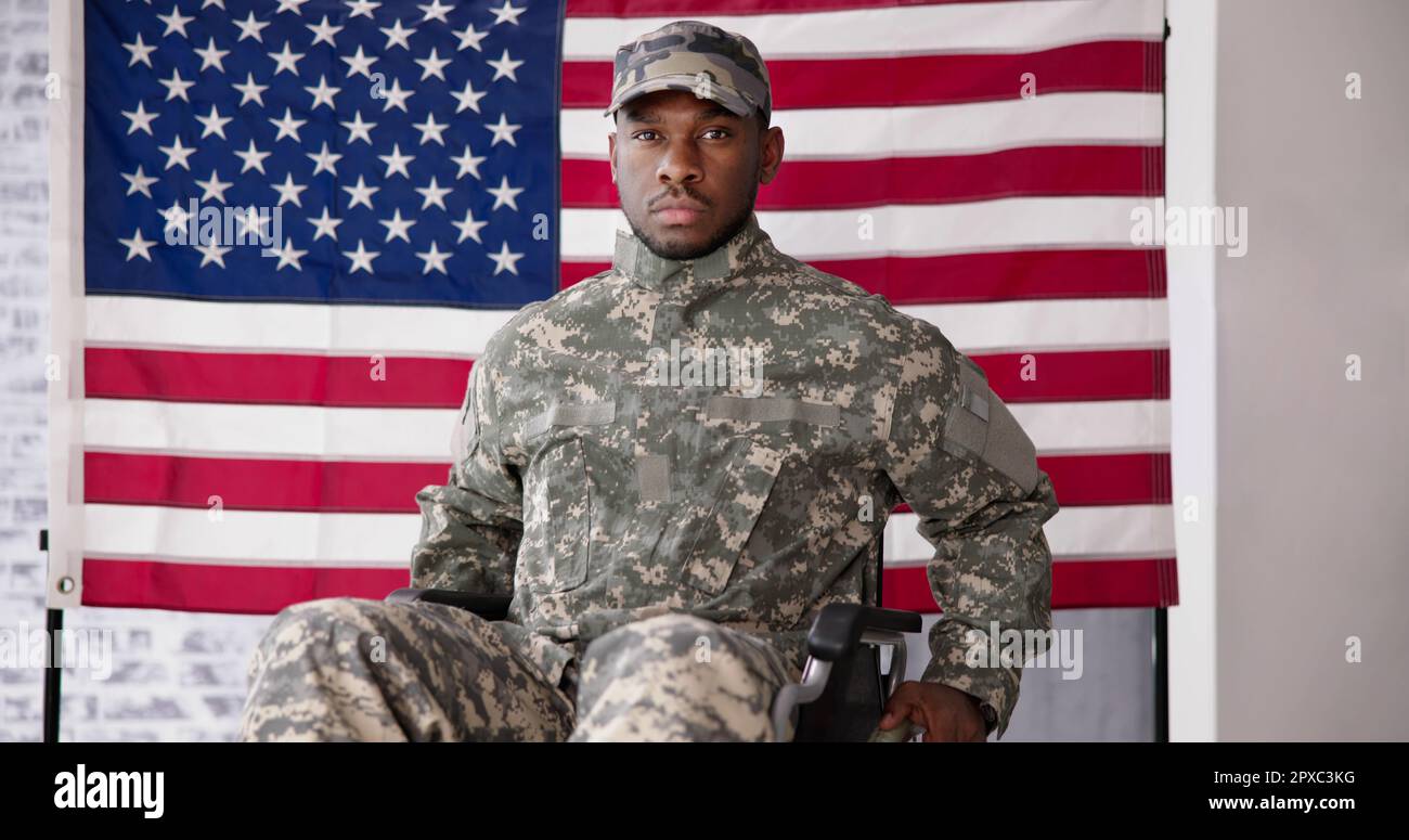 Veteran Sitting In Wheelchair In Front Of An American Flag Stock Photo ...