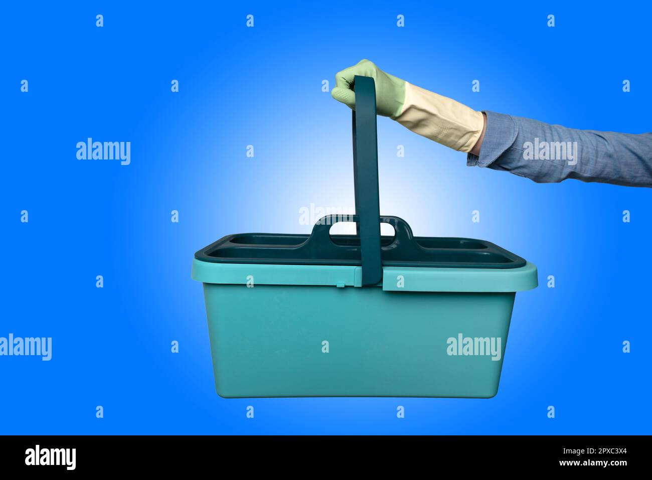 Plastic bucket for cleaning supplies womens hand holding. Spring ...