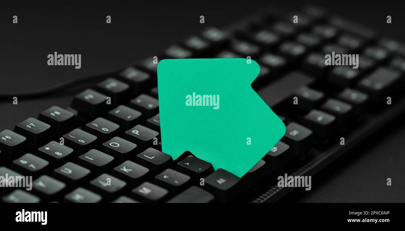 Sticker lying on black keyboard. Important message written over paper ...