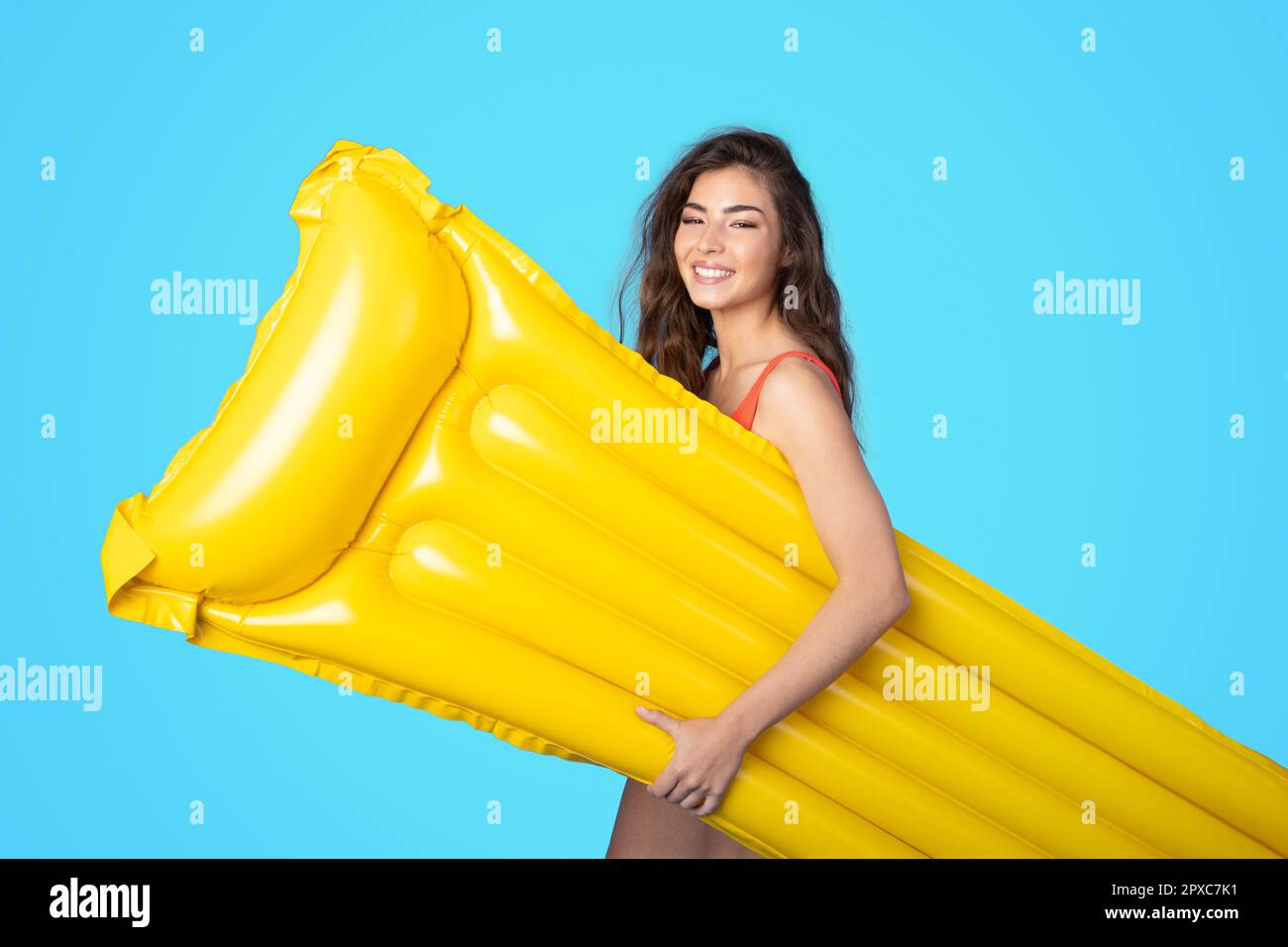 Glad Young European Slim Lady In Swimsuit Holding Inflatable Mattress Has Fun At Summer Stock