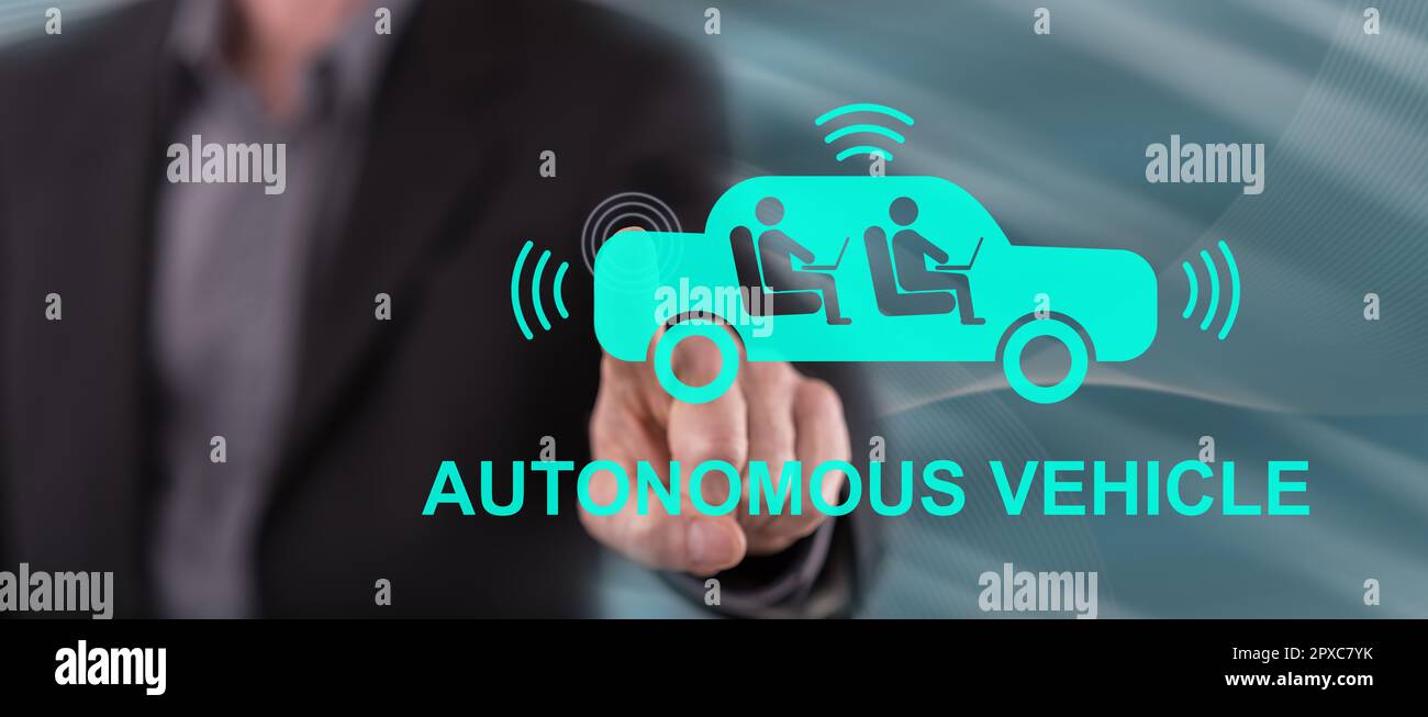 Man touching an autonomous vehicle concept on a touch screen with his ...