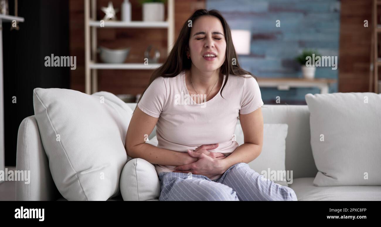 Woman With PMS And Stomach Digestion Problem Stock Photo - Alamy