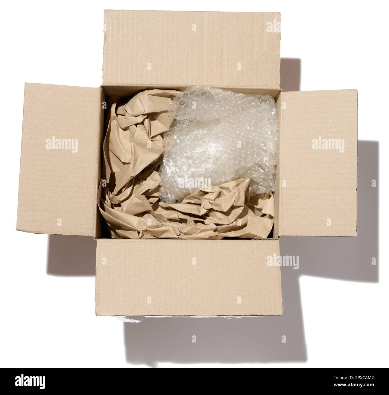 Open cardboard box, inside crumpled paper and polyethylene, top view ...