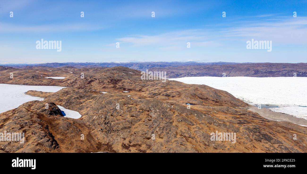 Greenlandic tundra landscape with ice cap melting, aerial view, near ...