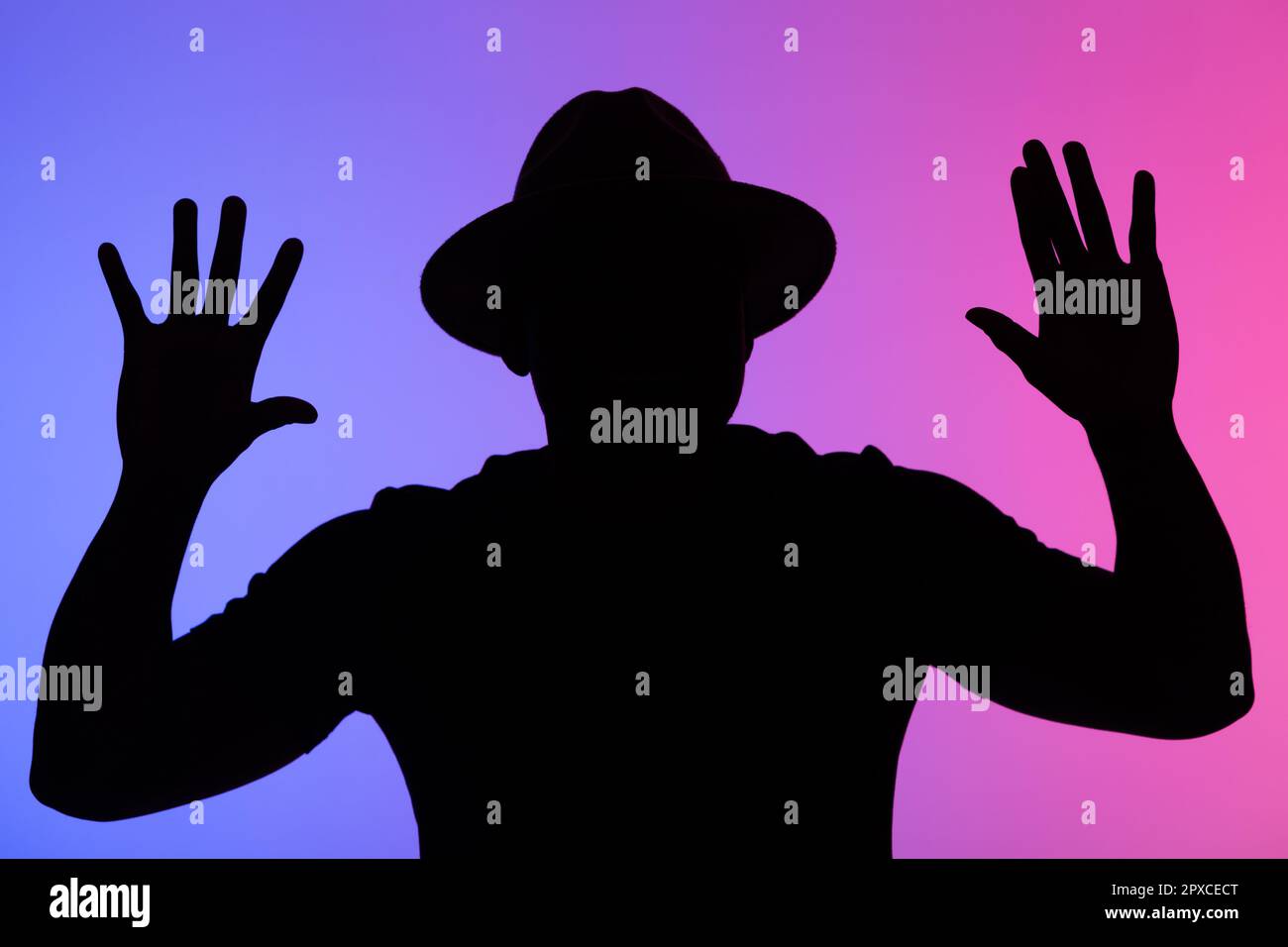 Silhouette of perplexed young african american man his hands up guy on ...