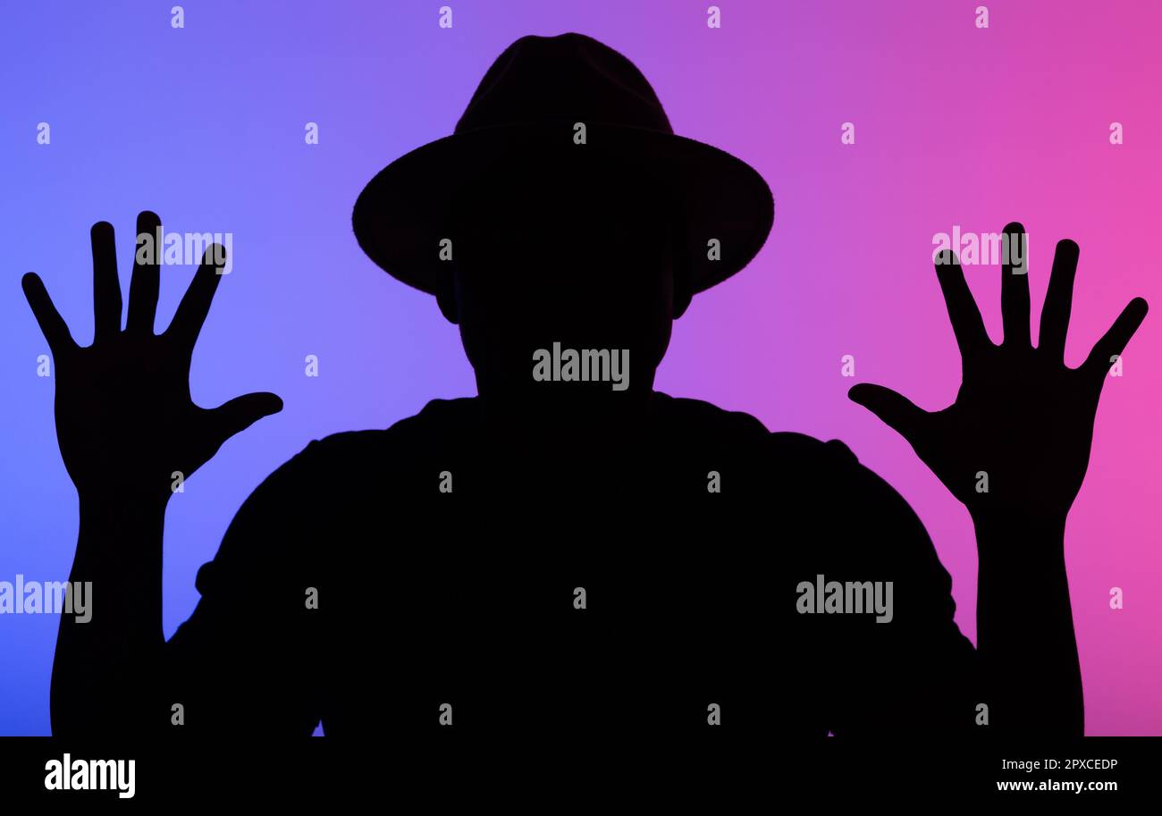 Silhouette of perplexed young african american man his hands up guy on ...