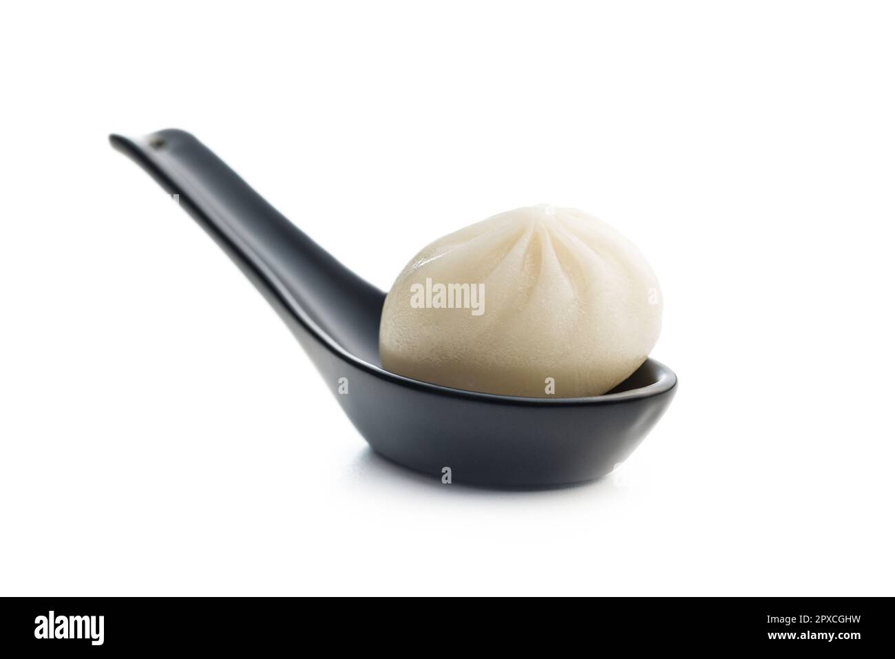 Xiaolongbao, traditional steamed dumplings in spoon. Xiao Long Bao buns ...